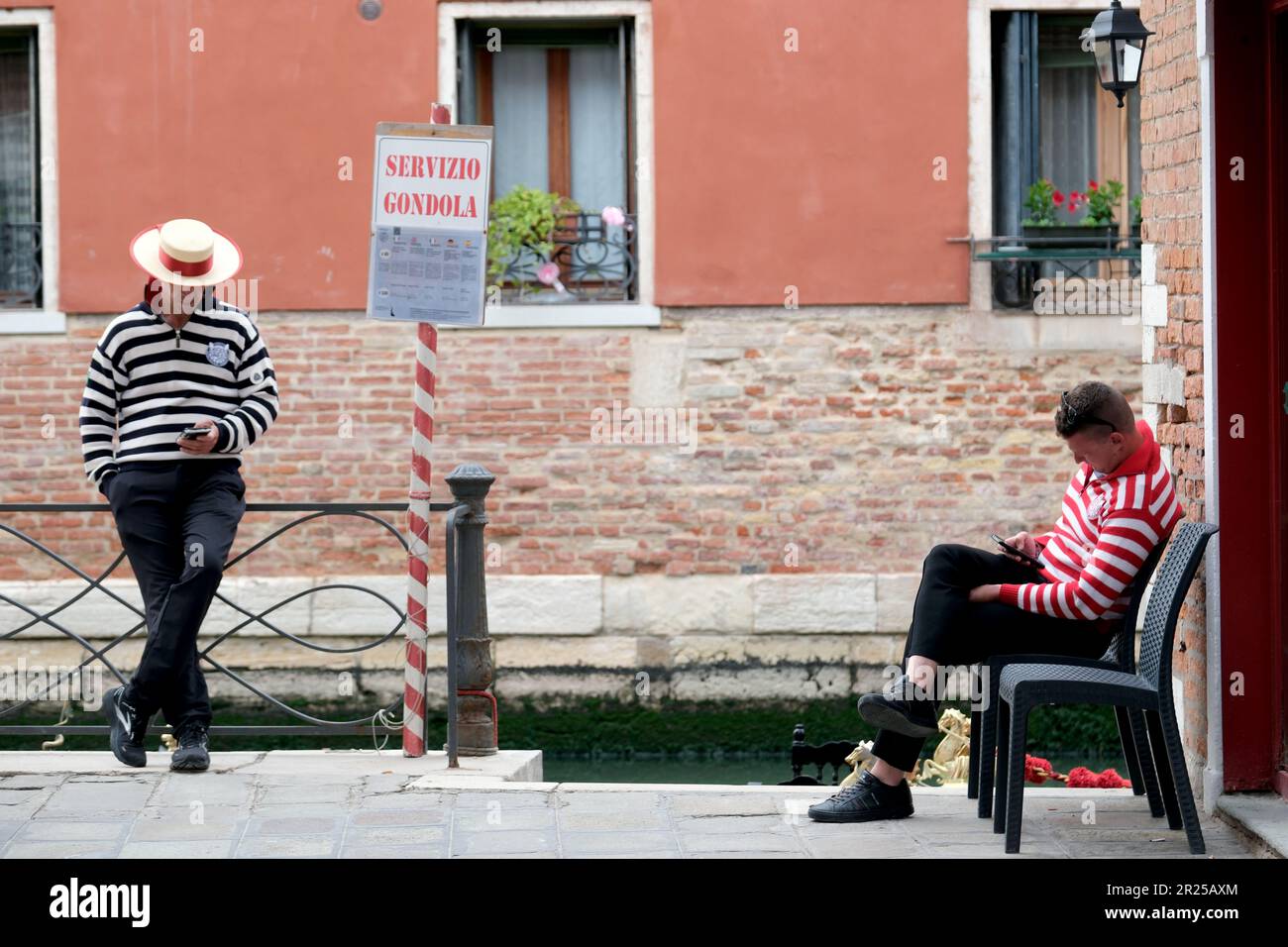 Gondoliers attend the guest in Venice, Italy, May 17., 2023 Stock Photo ...