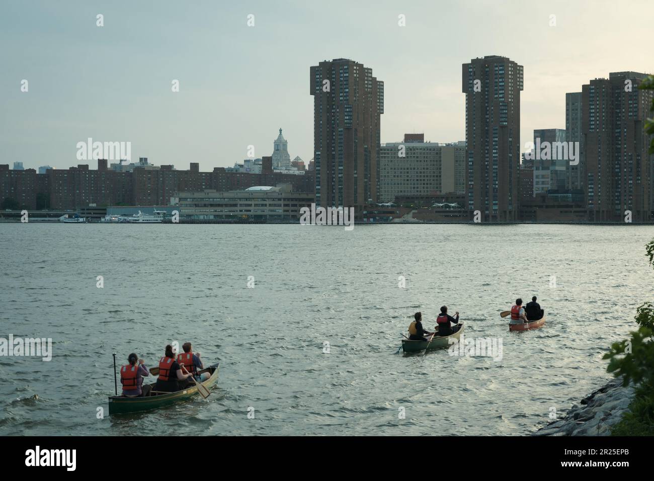 Canoes in the East River, seen from the waterfront of Long Island City ...