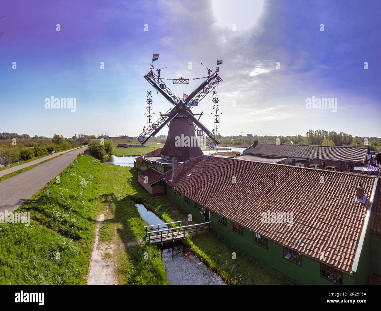 Paper producing windmill called De Schoolmeester with decorated wings ...