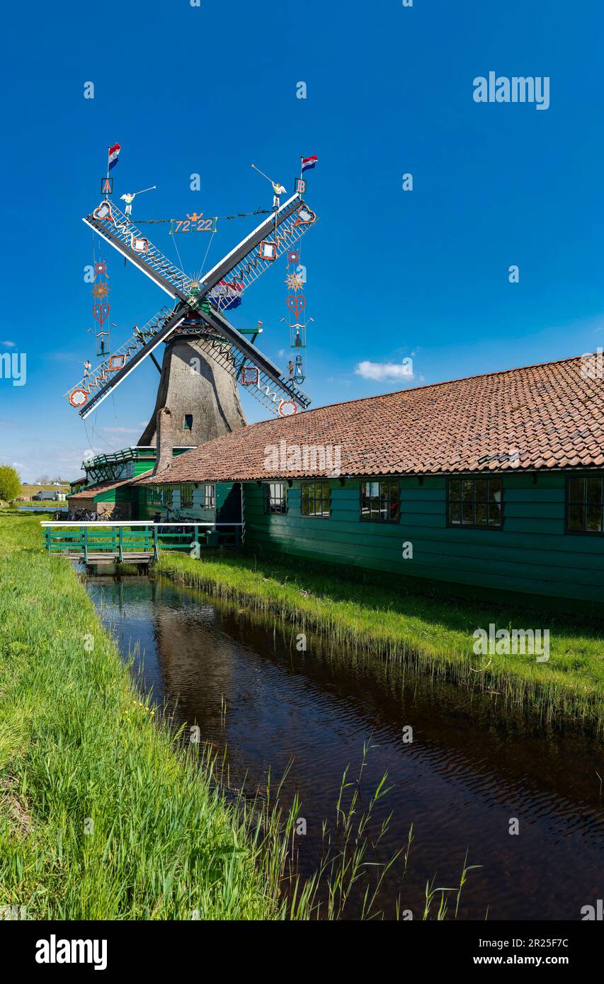 Paper producing windmill called De Schoolmeester with decorated wings ...