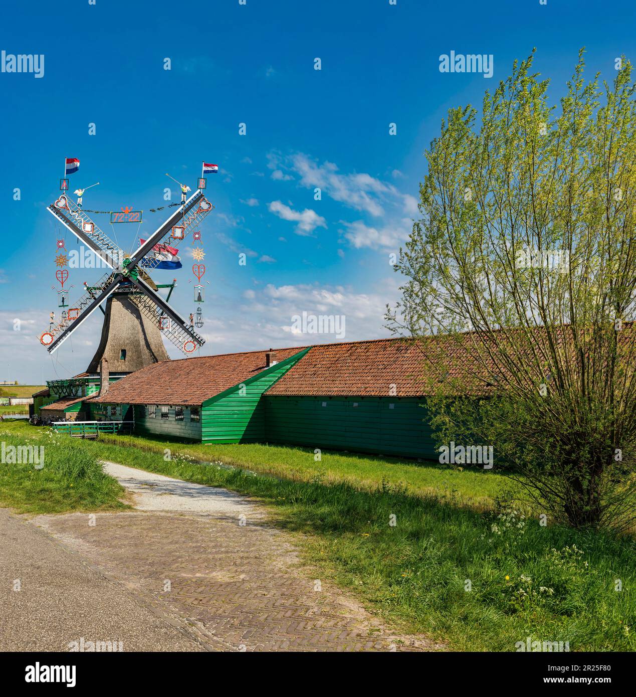 Paper producing windmill called De Schoolmeester with decorated wings ...