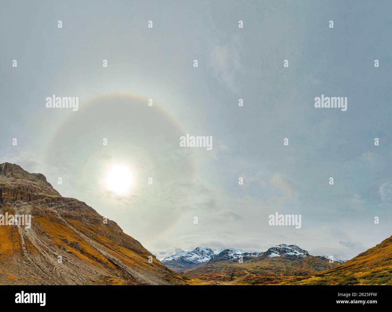 A halo above a mountain range *** Local Caption *** Bernina pass ...