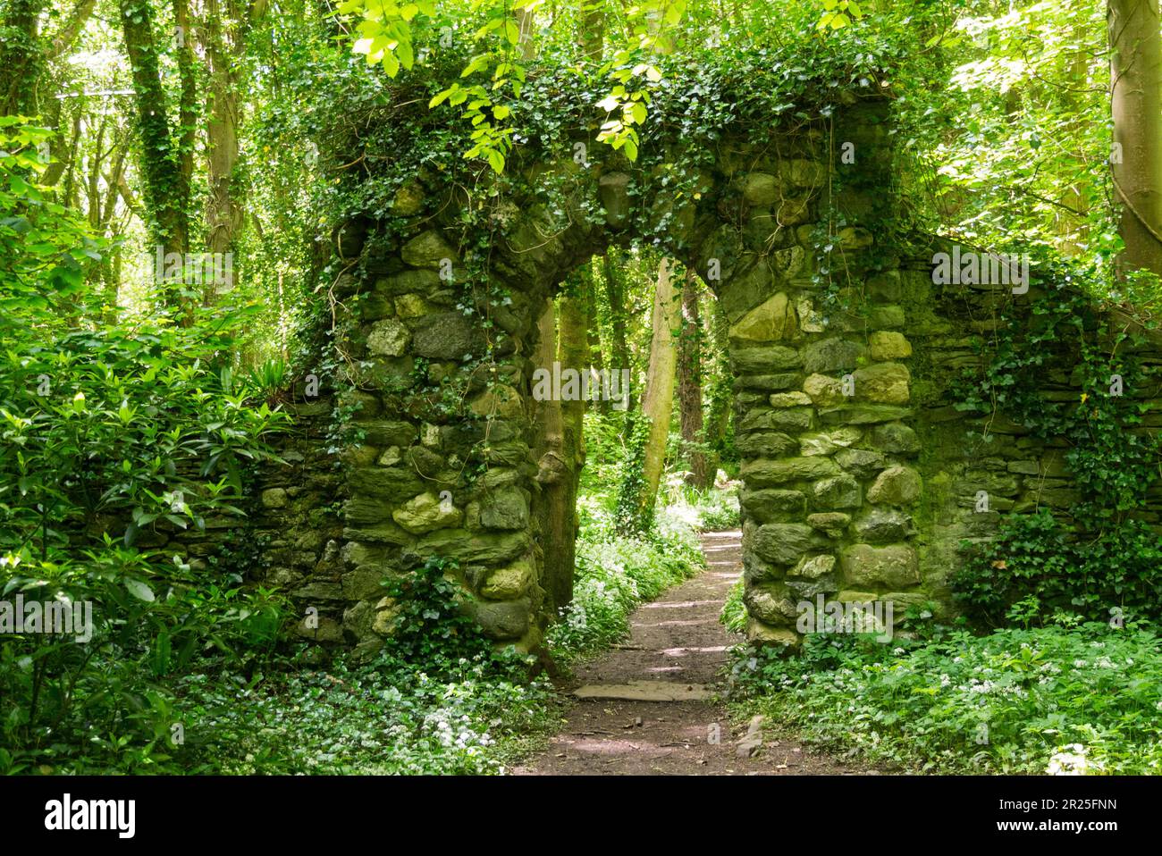 Path through a stone archway in Penrhos County Park Holyhead Isle of ...
