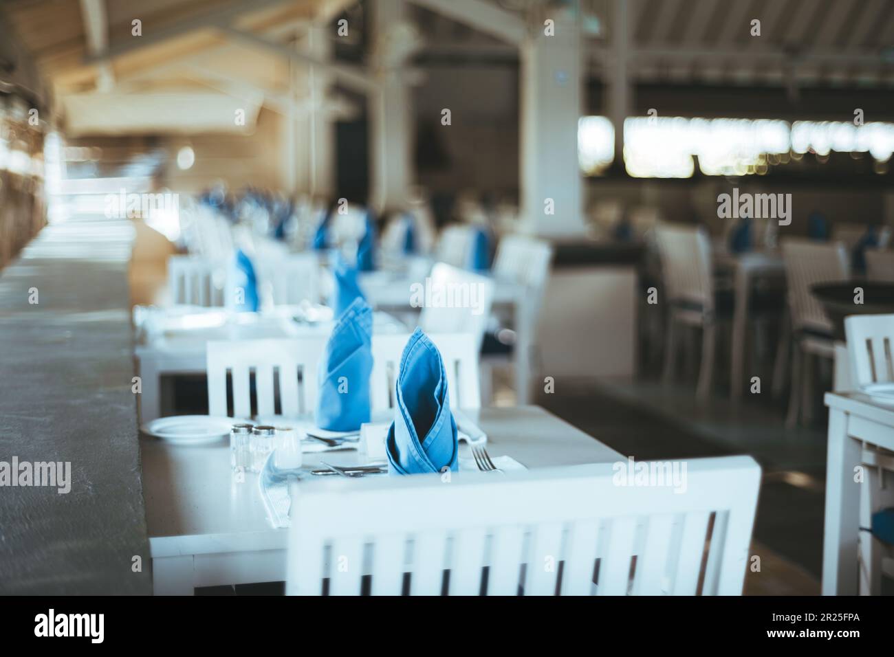 Maldives; selective focus on a table with blue decoratively folded ...
