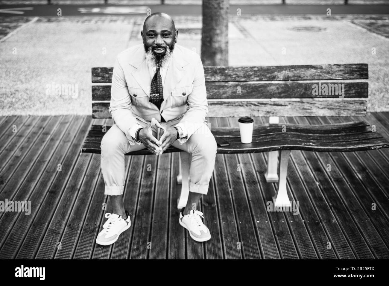 Lisbon; A black and white shot of a fancy bald unshaven black man ...