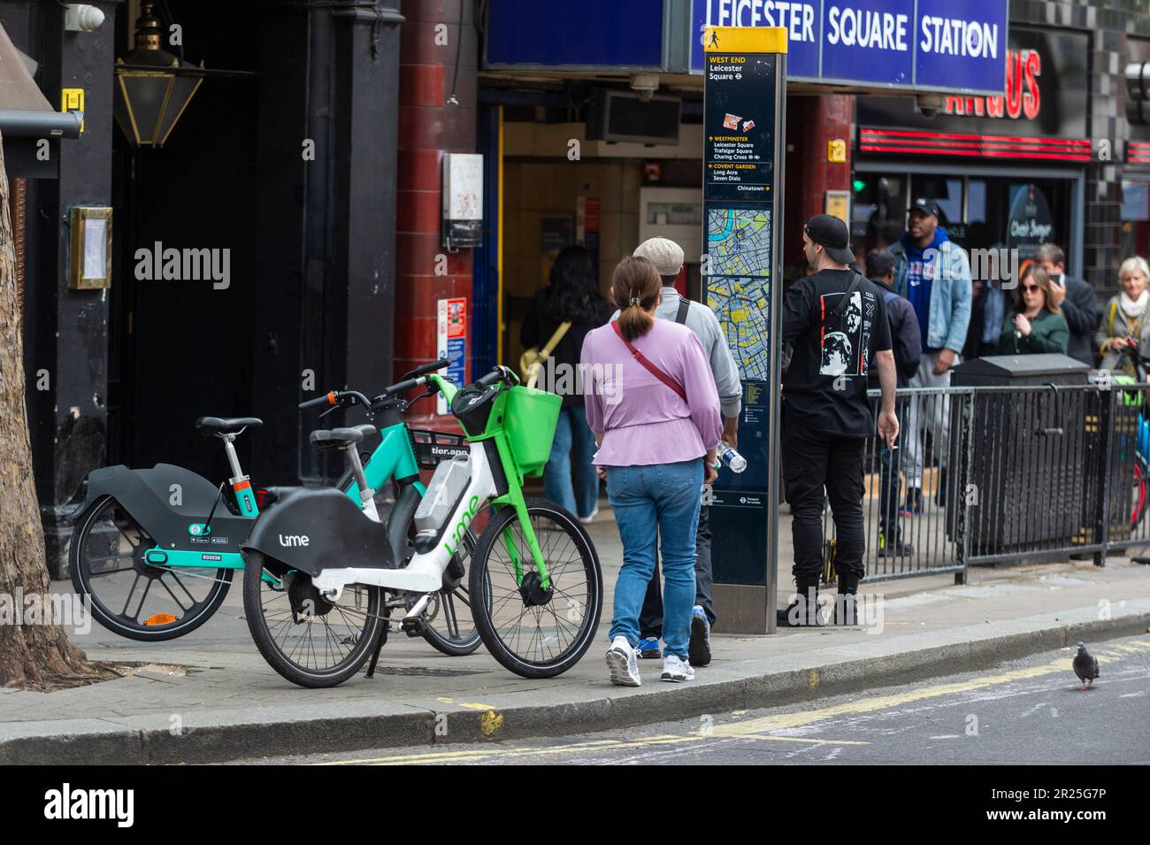 London, UK. 17 May 2023. The public passes electric hire cycles on a ...