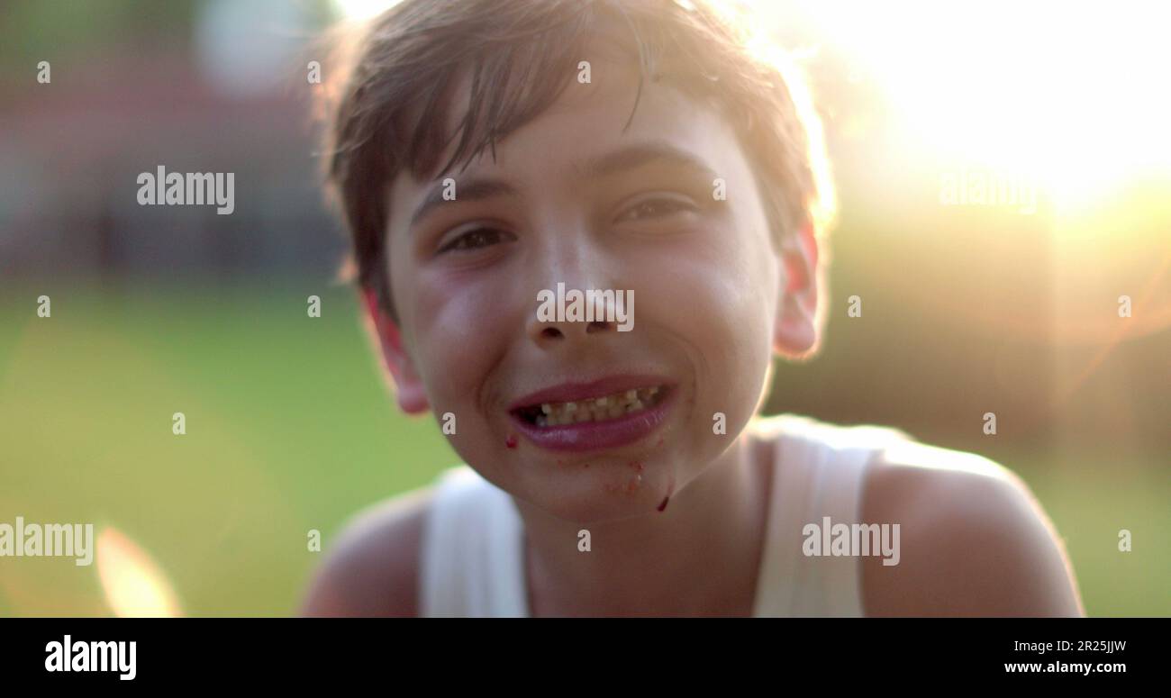 Young boy child wearing braces posing outside Stock Photo - Alamy