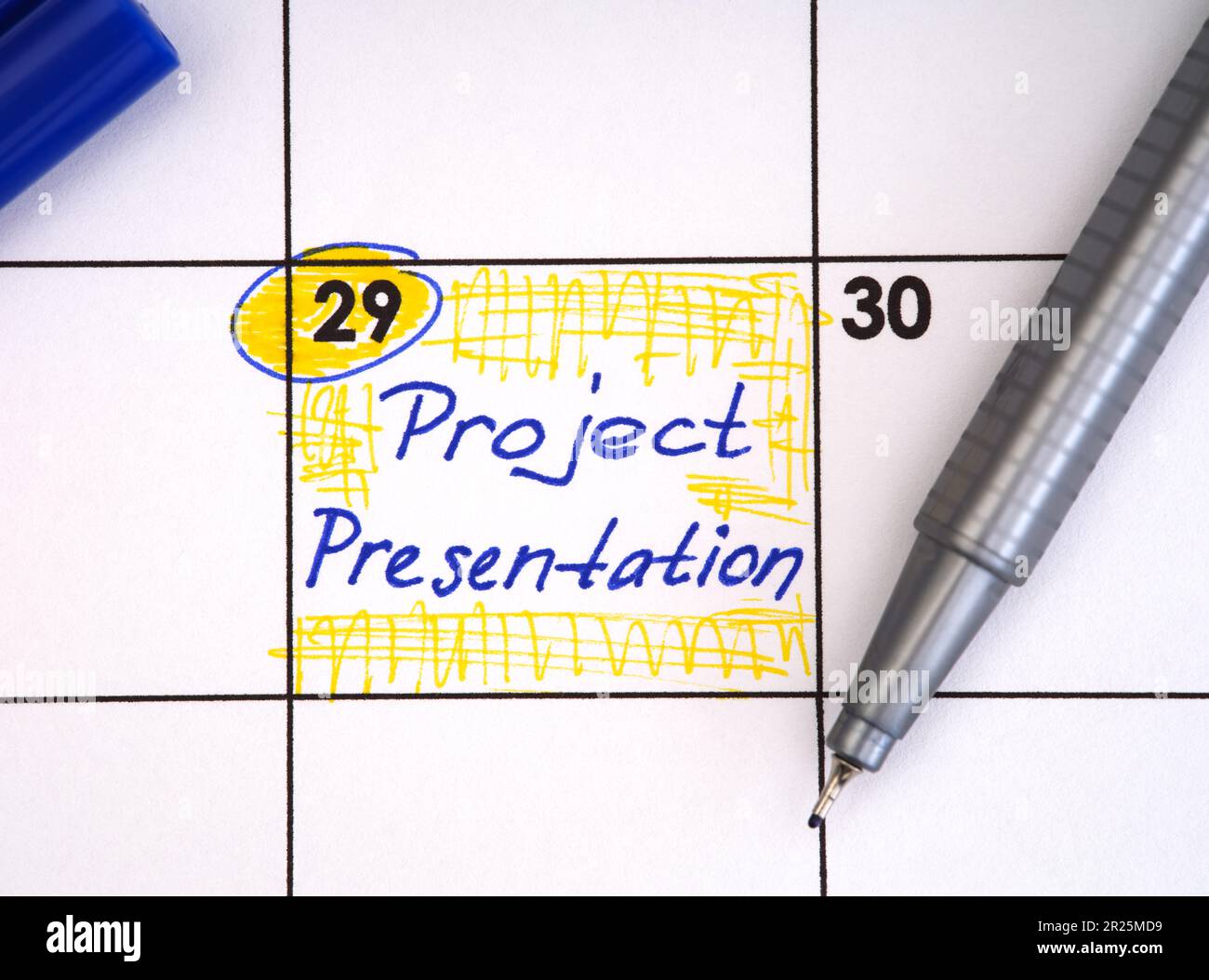 Handwritten reminder Project Presentation in the calendar with a blue ...