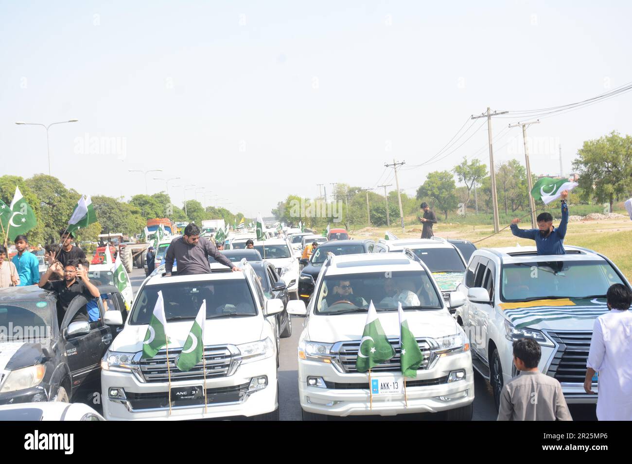 Islamabad, Pakistan. 17th May, 2023. People carrying flags of Pakistan ...