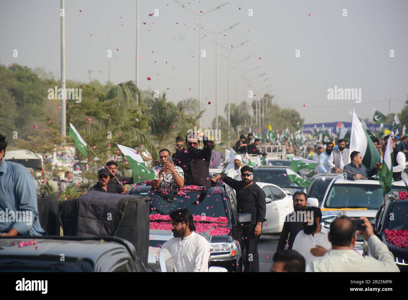 Islamabad, Pakistan. 17th May, 2023. People carrying flags of Pakistan ...