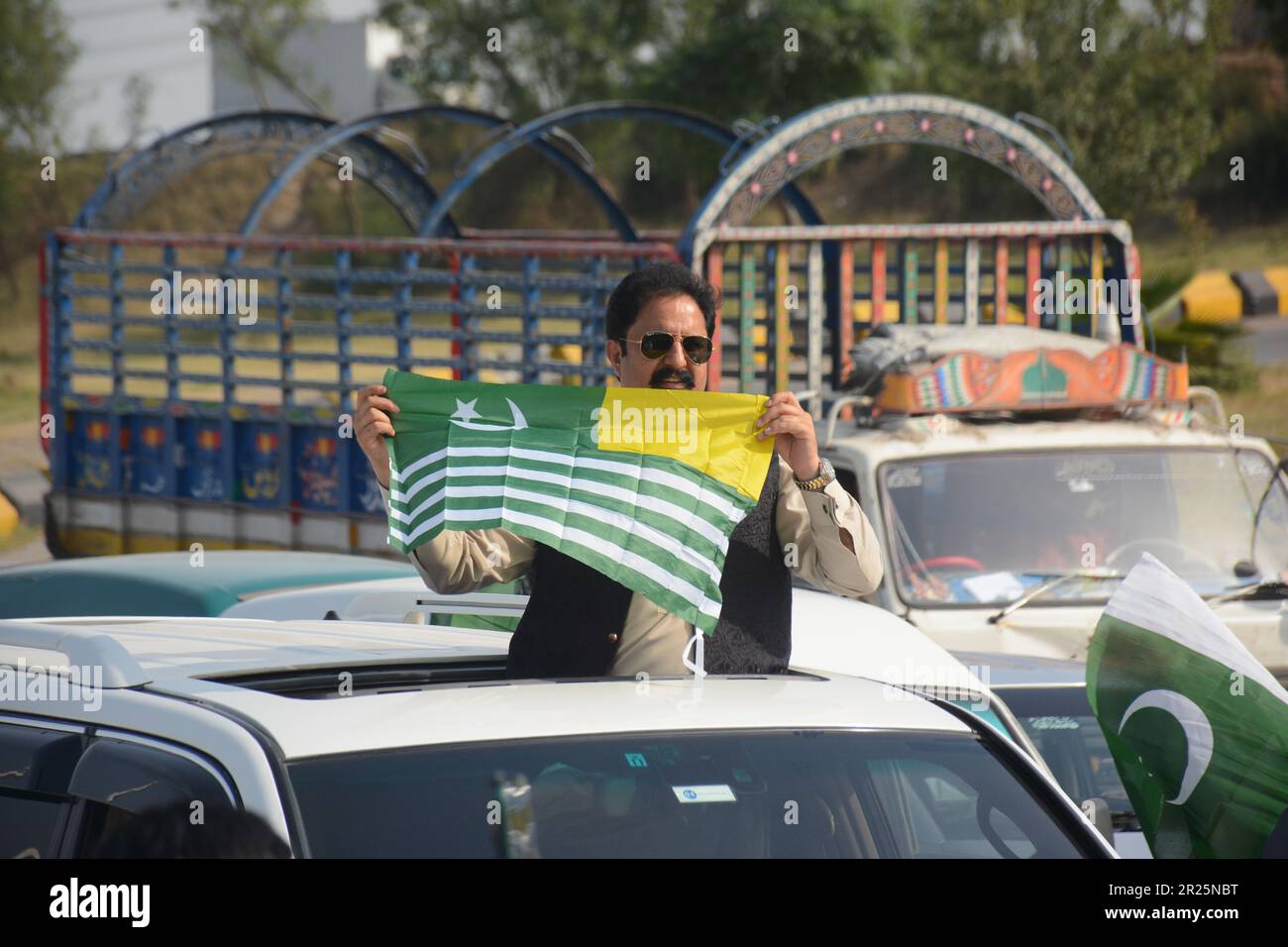 Islamabad, Pakistan. 17th May, 2023. People carrying flags of Pakistan ...