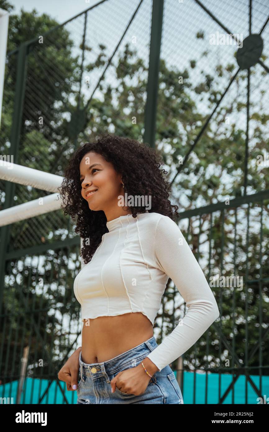 beautiful woman with dark and curly skin in a photo session on the ...