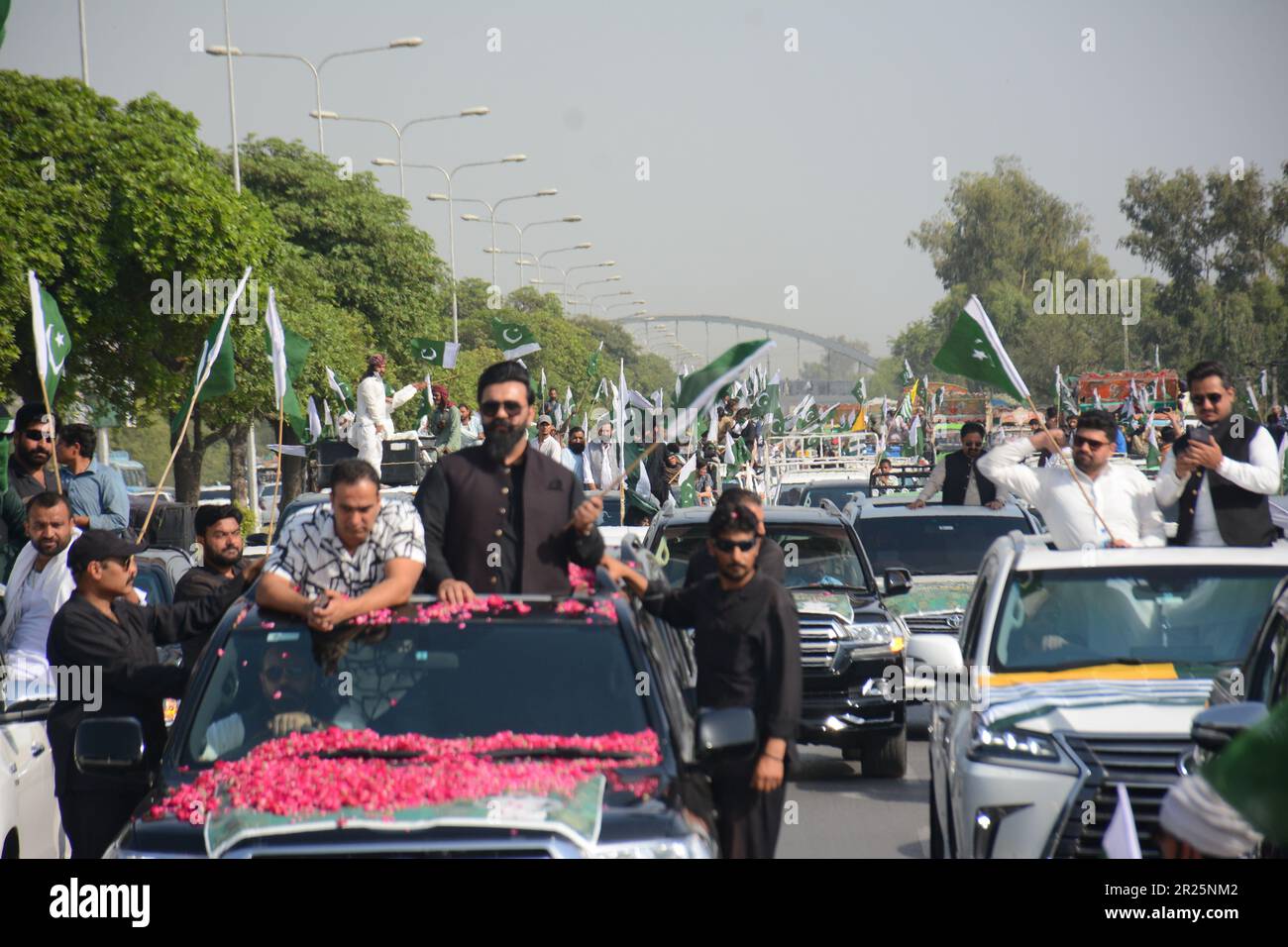 Islamabad, Pakistan. 17th May, 2023. People carrying flags of Pakistan ...