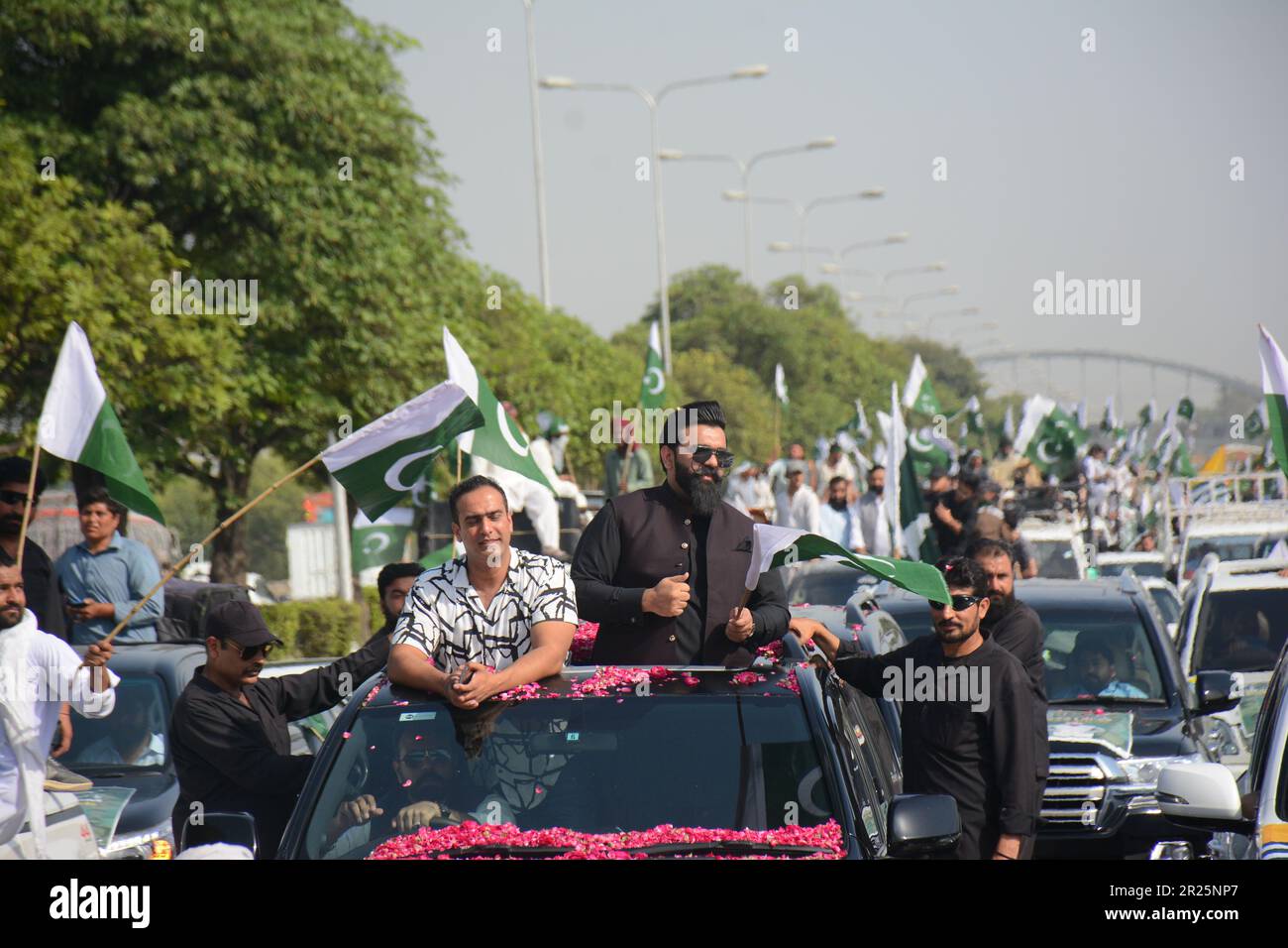 Islamabad, Pakistan. 17th May, 2023. People carrying flags of Pakistan ...