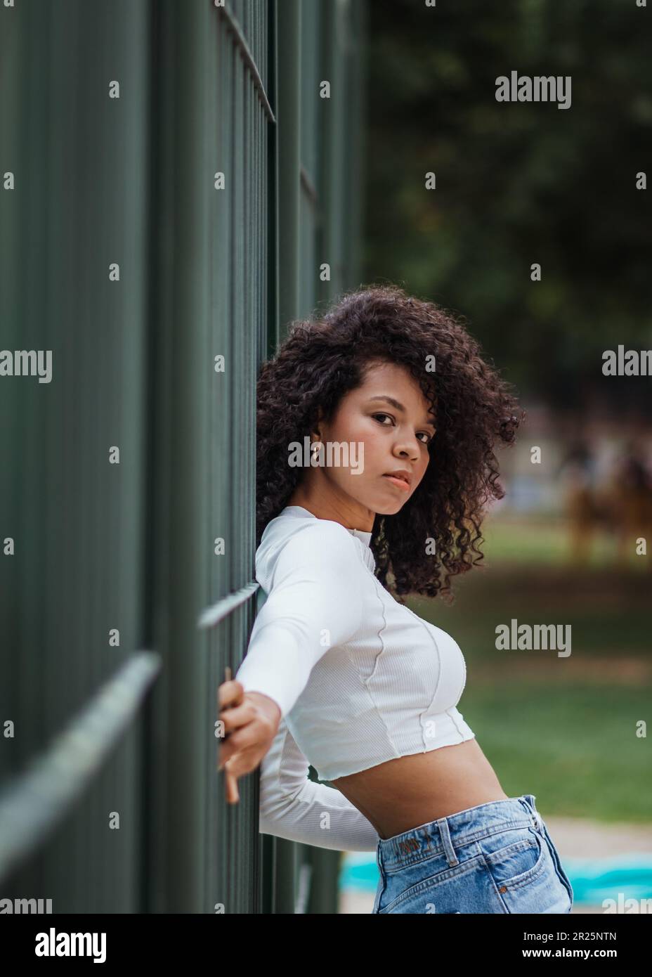 beautiful woman with dark and curly skin in a photo session on the ...