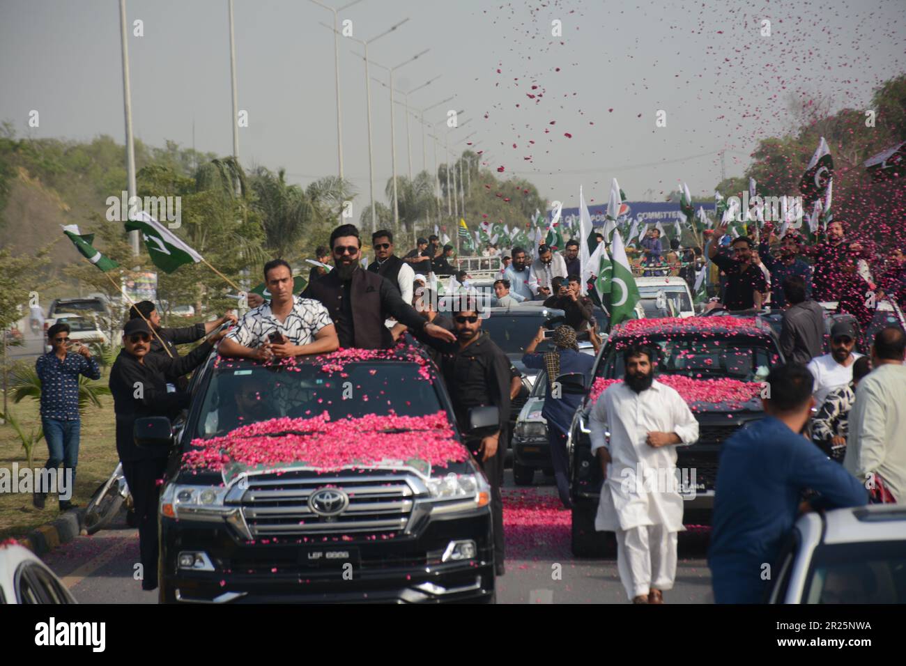 Islamabad, Pakistan. 17th May, 2023. People carrying flags of Pakistan ...