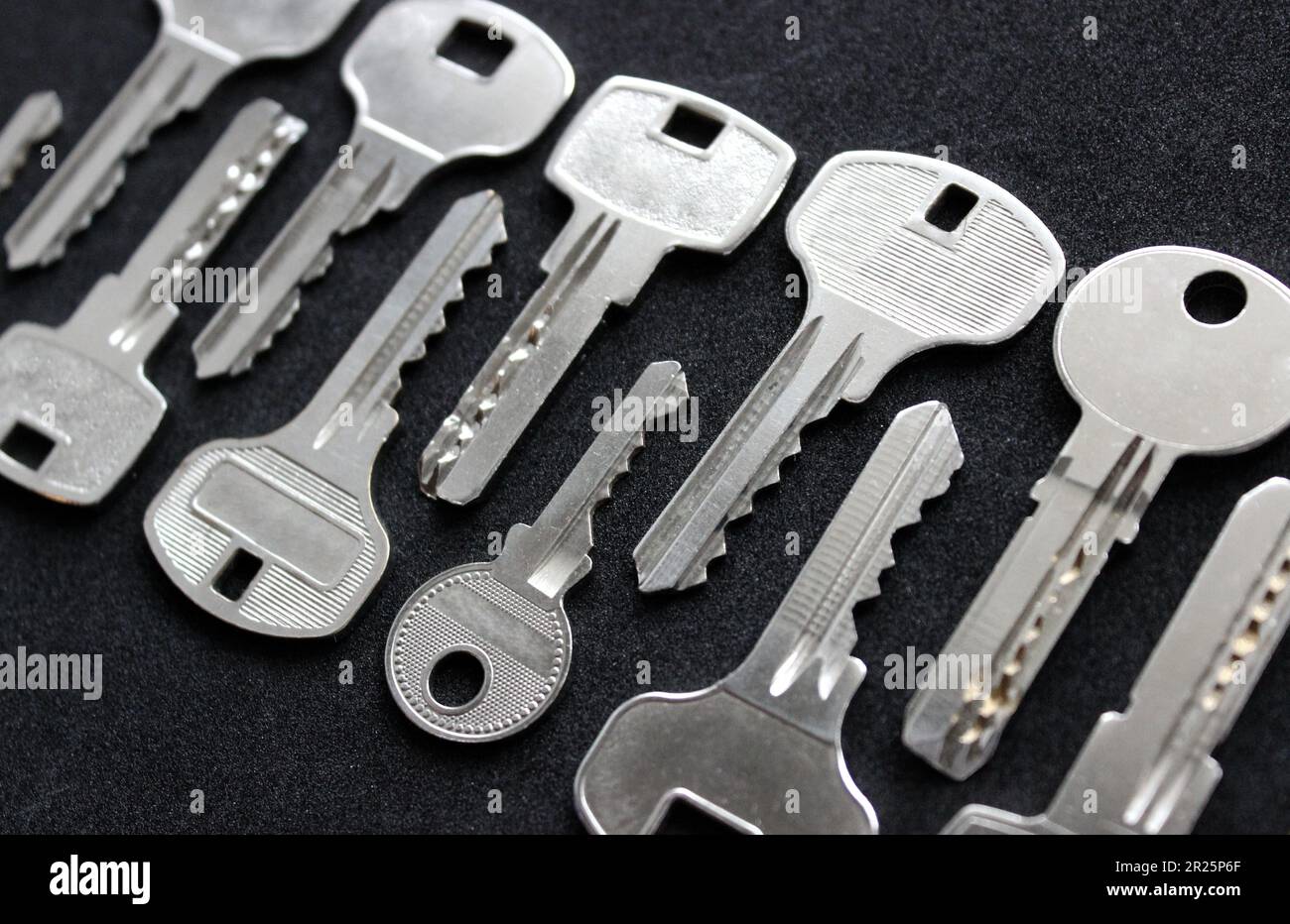 Metal Keys With Variety Types Of Blade In A Rows On Black Background ...