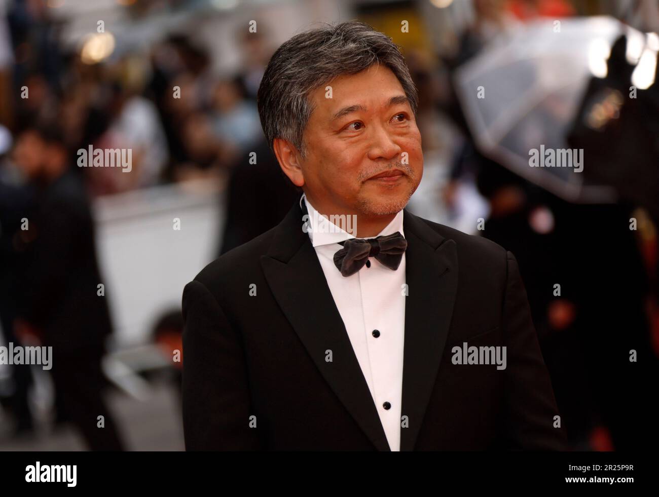 Director Hirokazu Koreeda poses for photographers upon arrival at the ...
