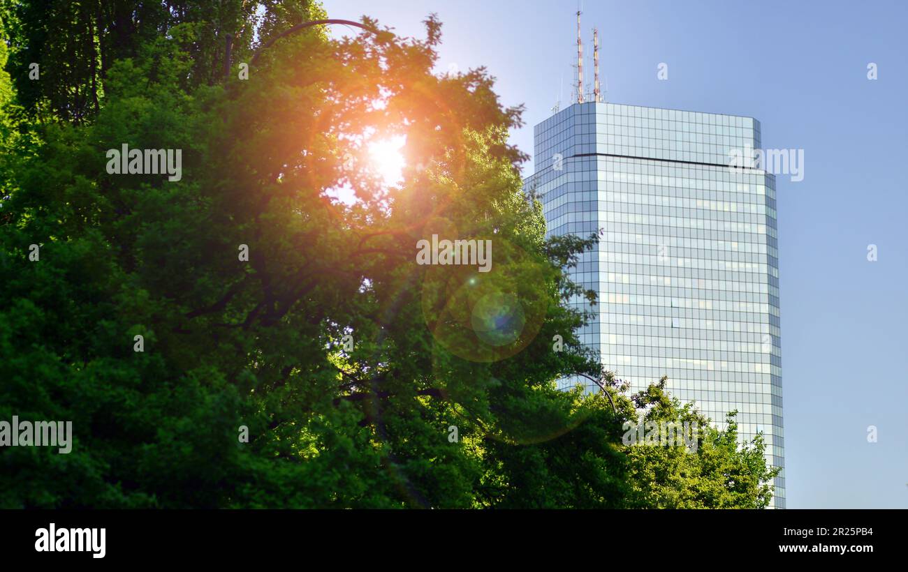 Reflection of modern commercial building on glass with sunlight. Eco ...