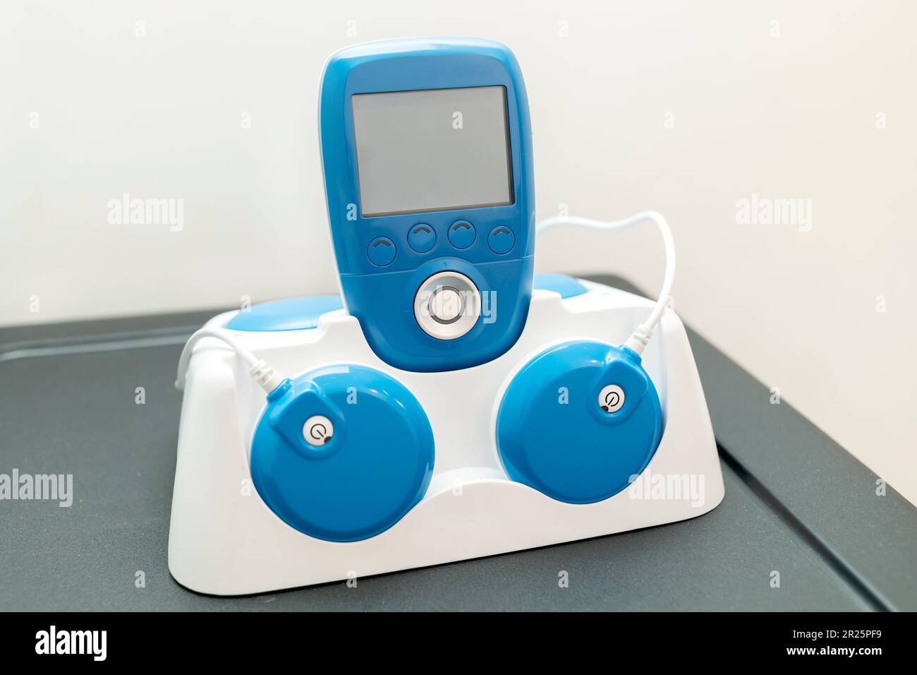 Closeup Blue Wireless Electric Muscle Stimulator, Pain Treatment on ...