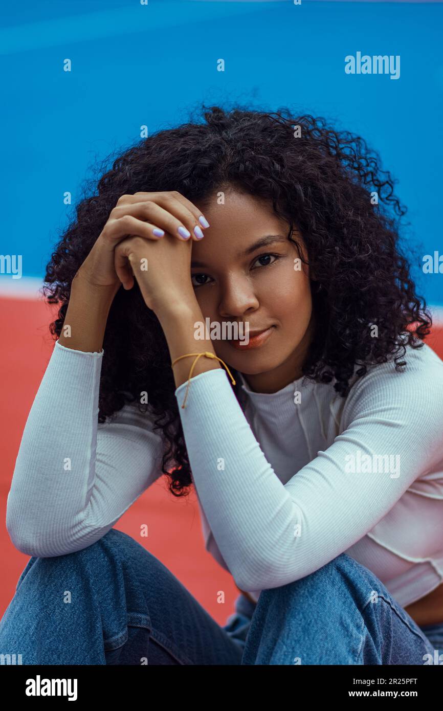 beautiful woman with dark and curly skin in a photo session on the ...