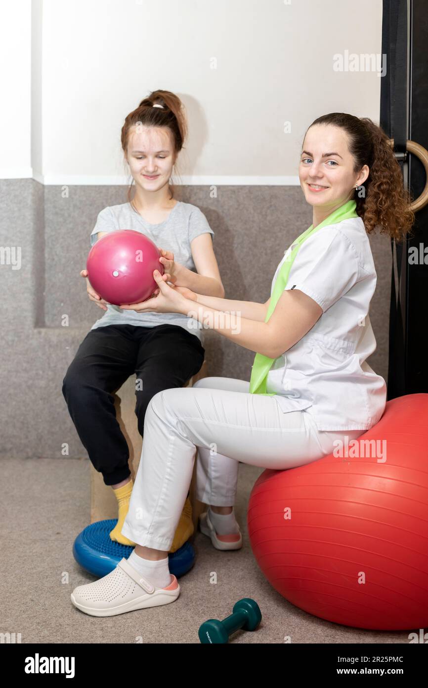 Smiling Child, Teenage Girl With Disability Does Physical Exercises ...