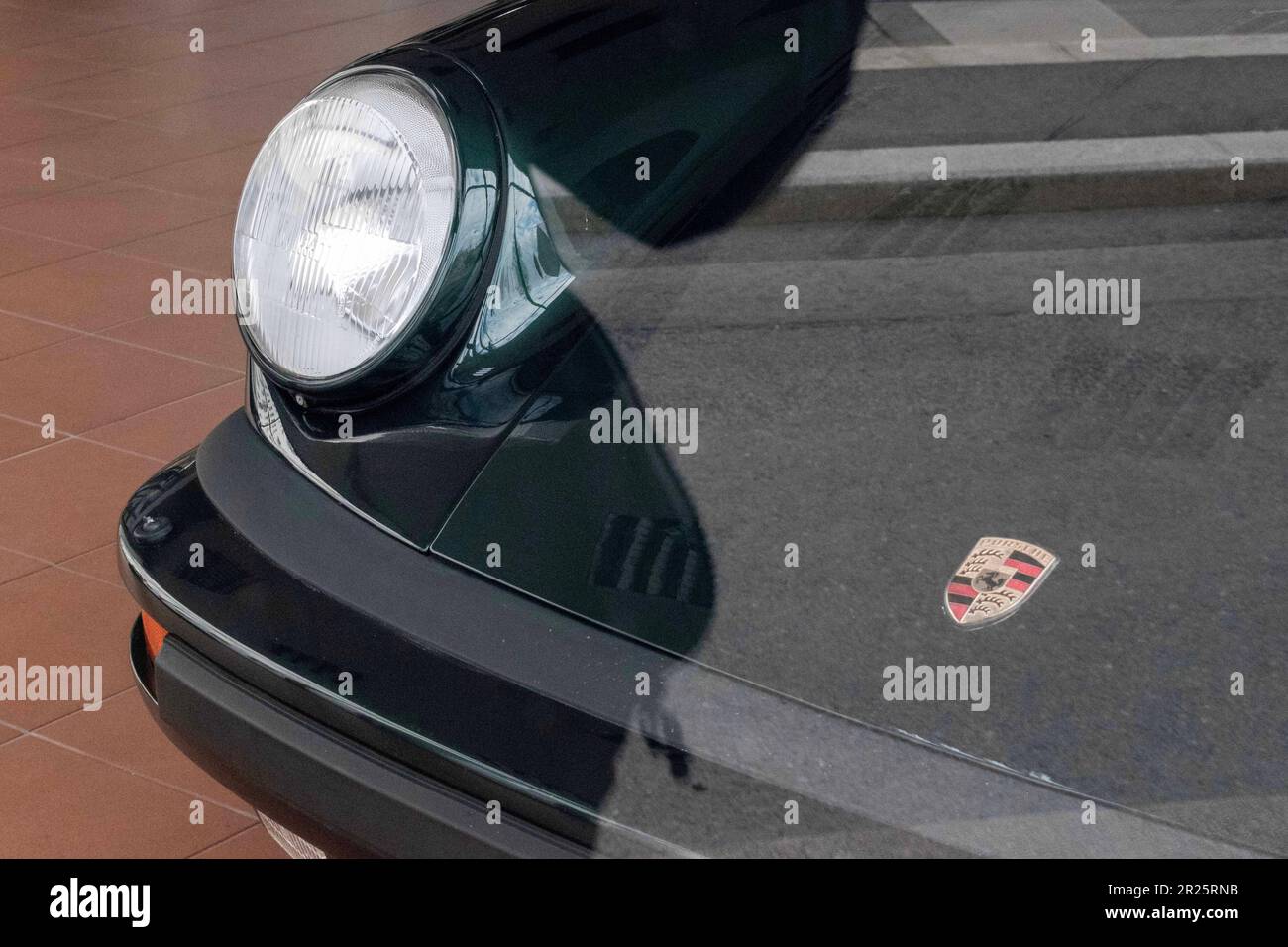 AUSTRIA, VIENNA - 5 April 2023 Porsche and reflection of zebra crossing ...