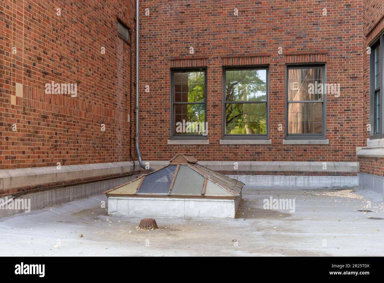 Old, vintage metal framed double pitched skylight on a flat commercial ...