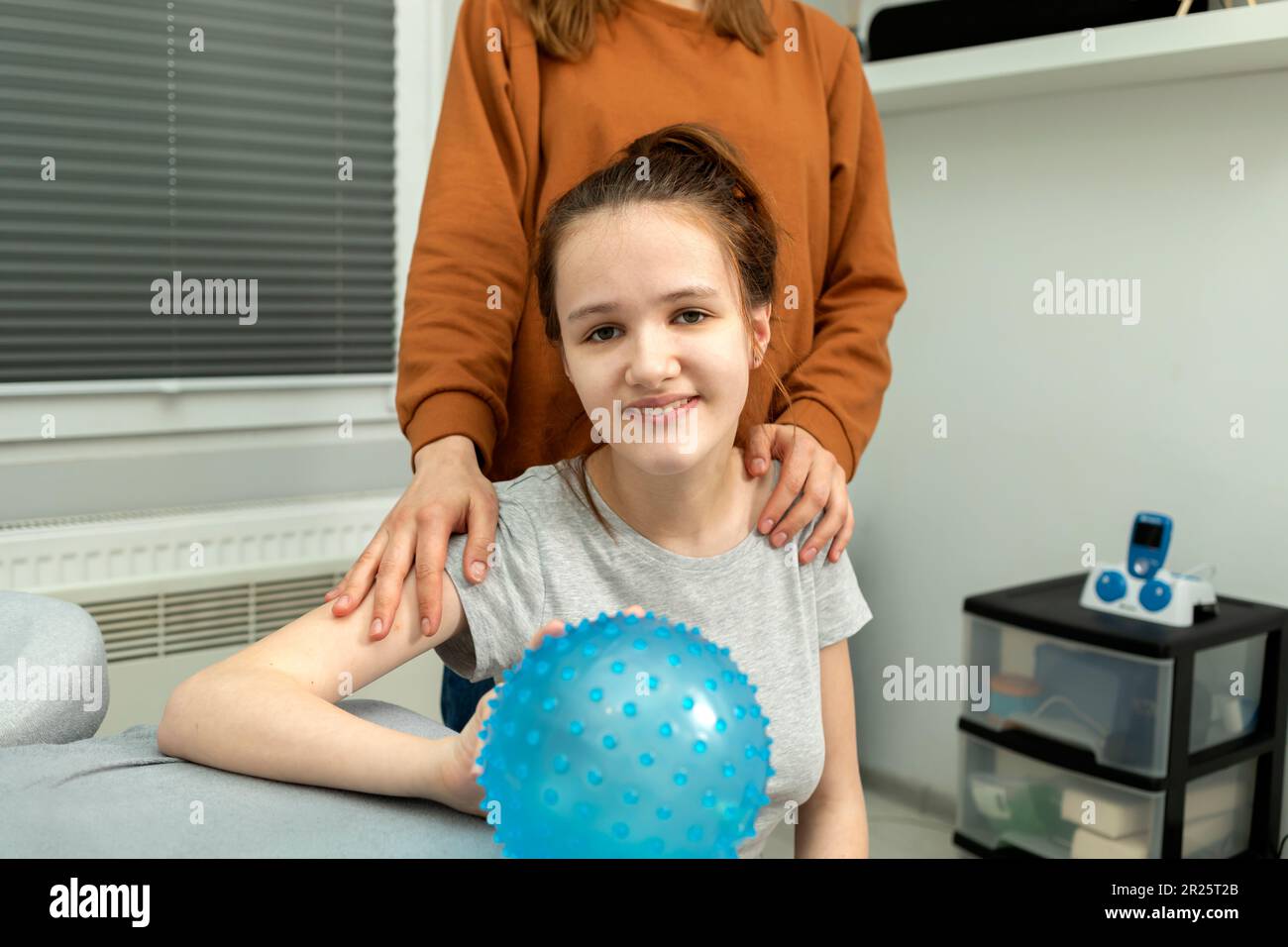 Portrait Of Pretty Smiling Teenage Girl With Disability With Mother ...