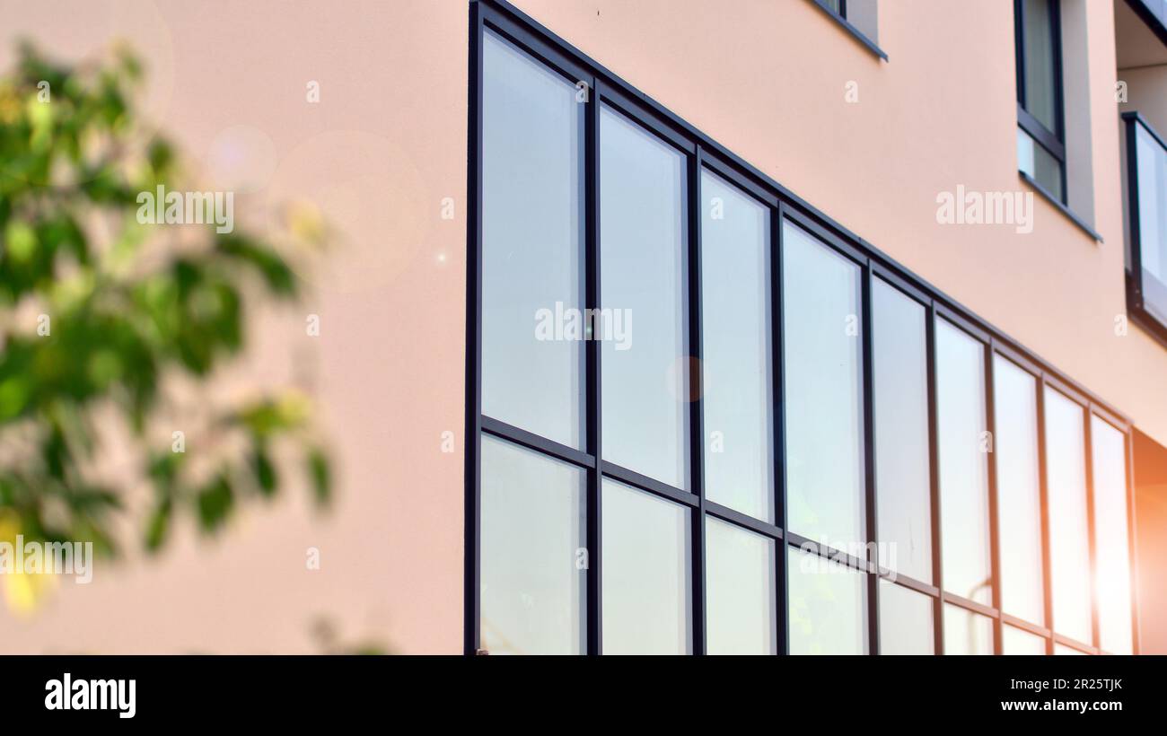 Reflection of modern commercial building on glass with sunlight. Eco ...