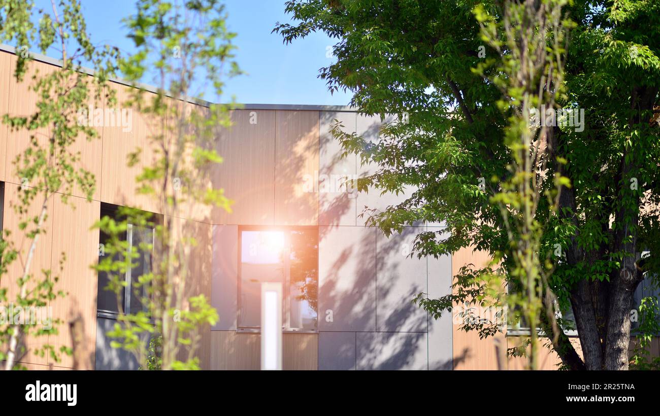 Reflection of modern commercial building on glass with sunlight. Eco ...