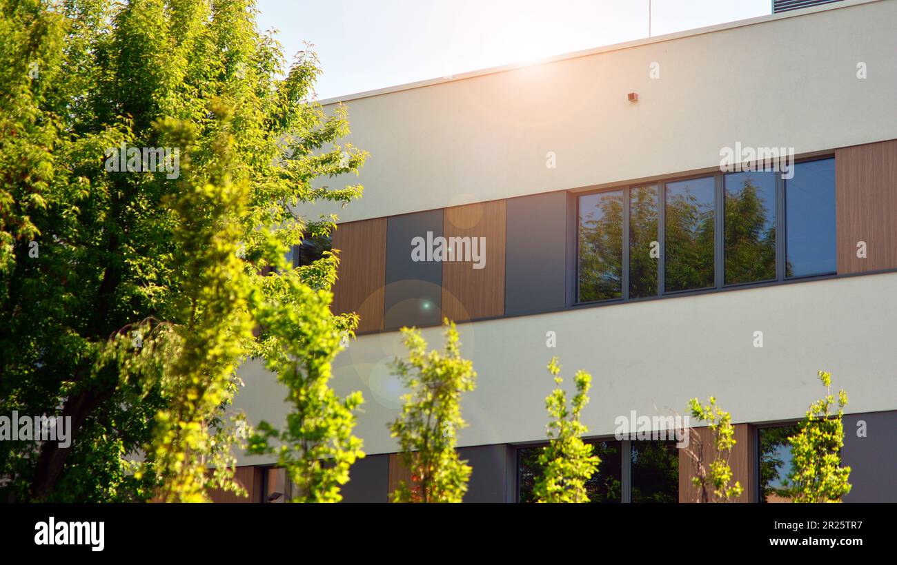 Reflection of modern commercial building on glass with sunlight. Eco ...