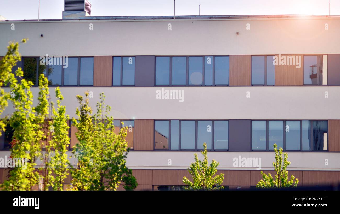 Reflection of modern commercial building on glass with sunlight. Eco ...
