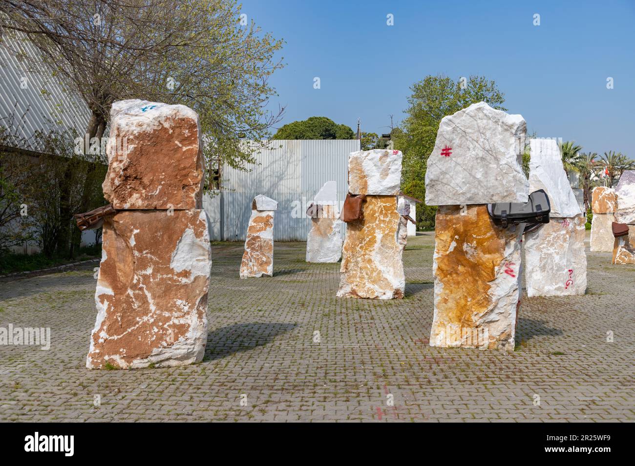A picture of an exhibit with stones and suitcases on display at the ...