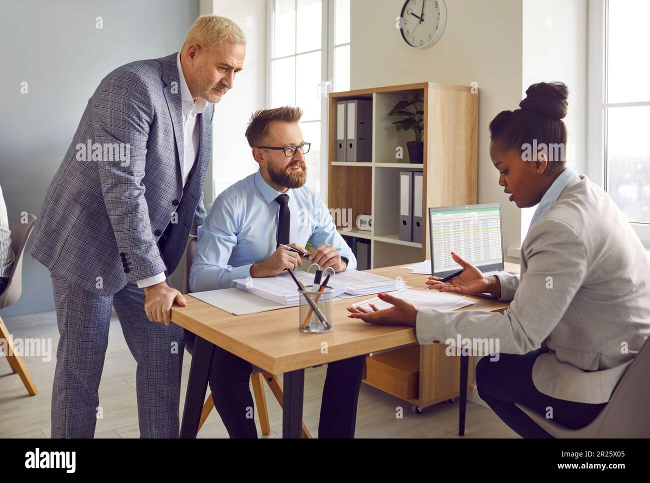 Group of business people discussing corporate project in office Stock ...