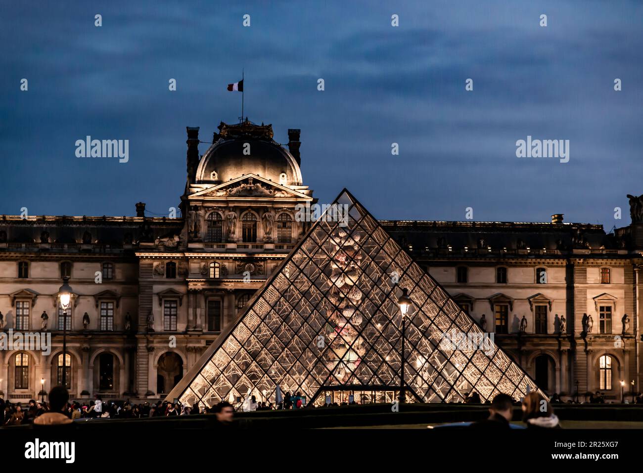 Paris, France - Dec. 30 2022: Louvre Palace facade with pyramid and ...