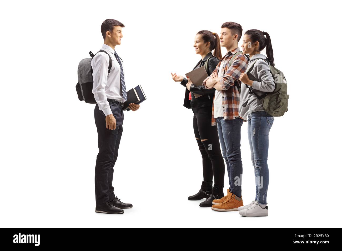 Full length profile shot of a male student having a conversation with a ...