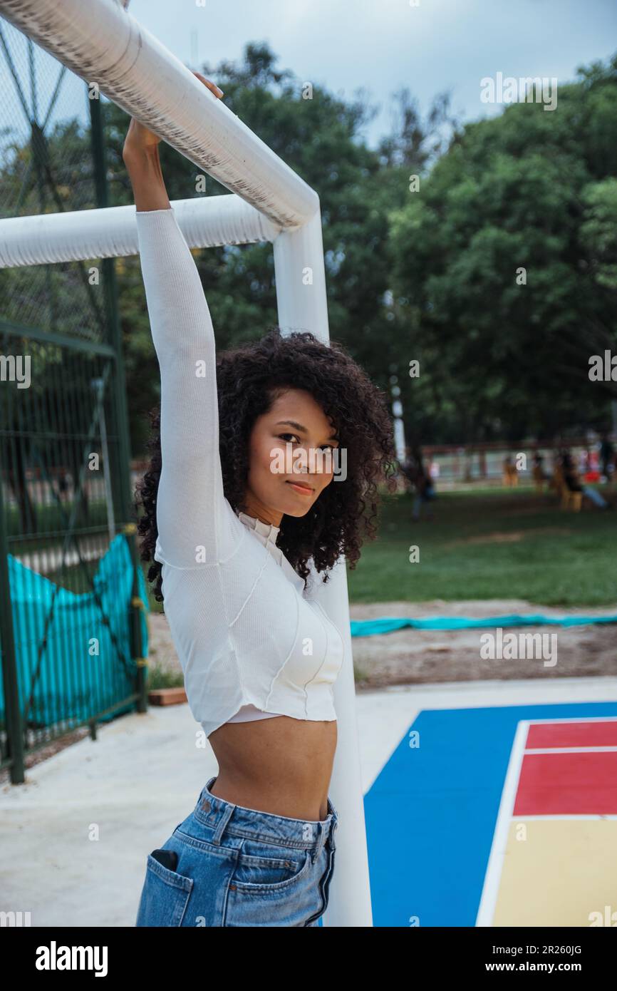beautiful woman with dark and curly skin in a photo session on the ...