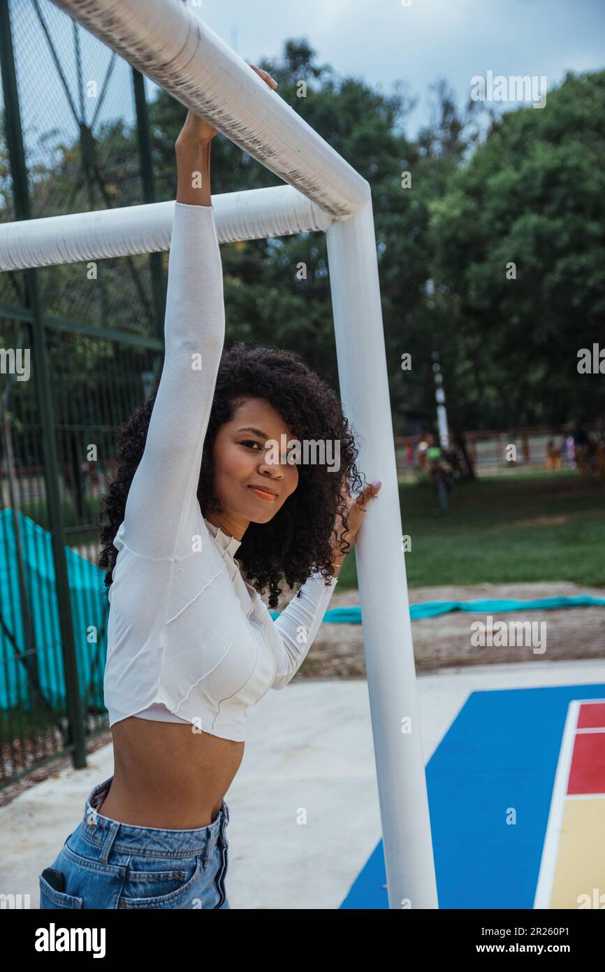 beautiful woman with dark and curly skin in a photo session on the ...