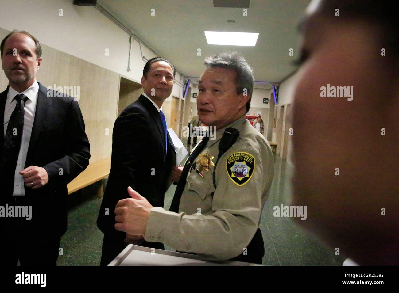 San Francisco Public Defender Jeff Adachi (second from left) walks ...