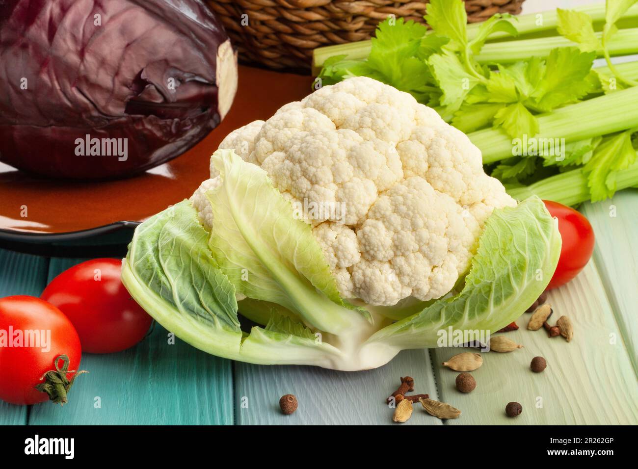 single cauliflower on wood background Stock Photo - Alamy