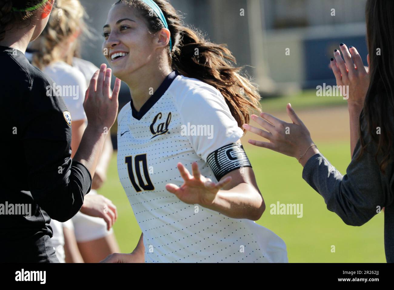 Arielle Ship, with the California Golden Bears, high fives teammates at ...