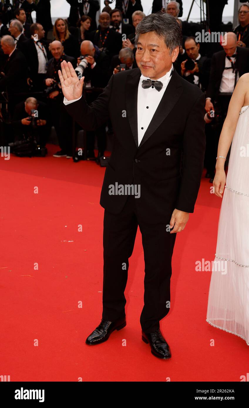 Director Hirokazu Koreeda poses for photographers upon arrival at the ...