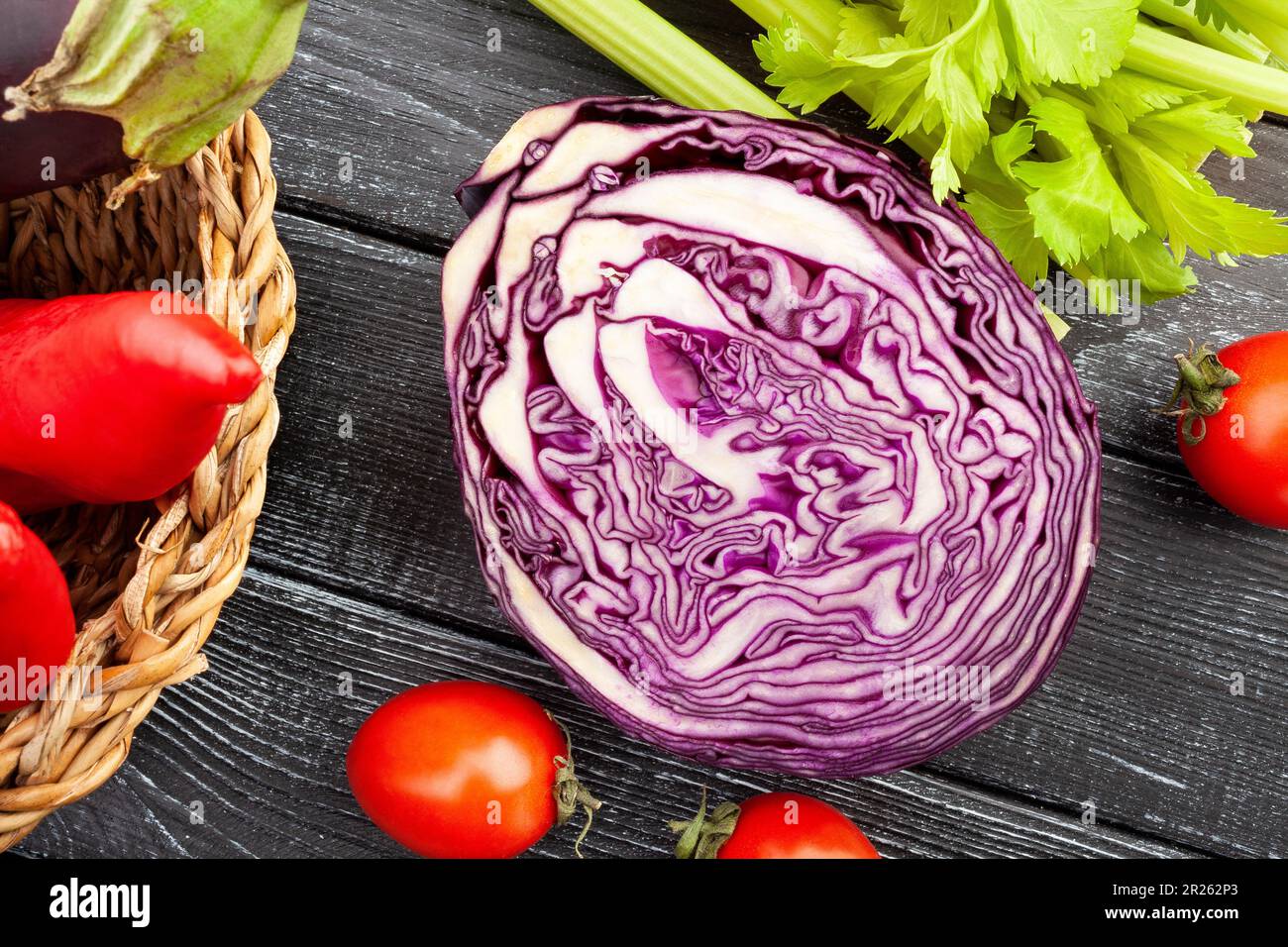sliced red cabbage on wood background Stock Photo - Alamy