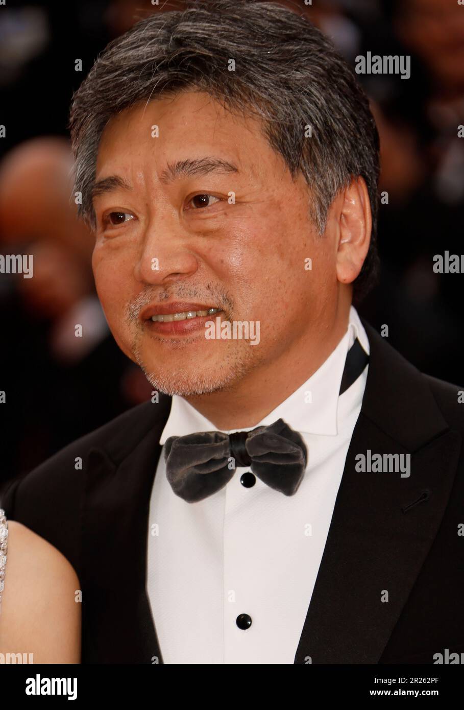 Director Hirokazu Koreeda poses for photographers upon arrival at the ...