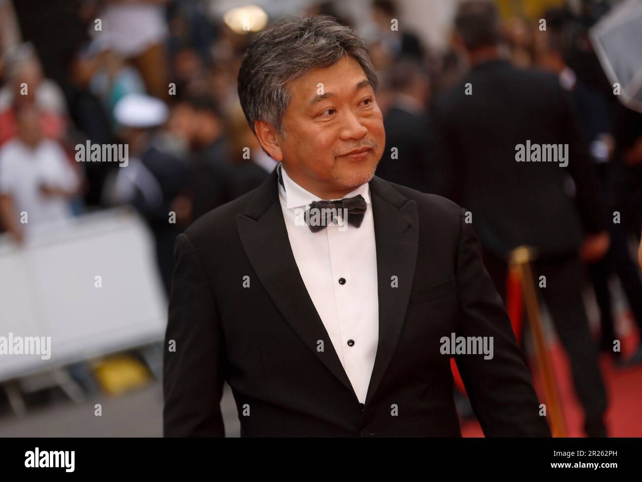 Director Hirokazu Koreeda poses for photographers upon arrival at the ...