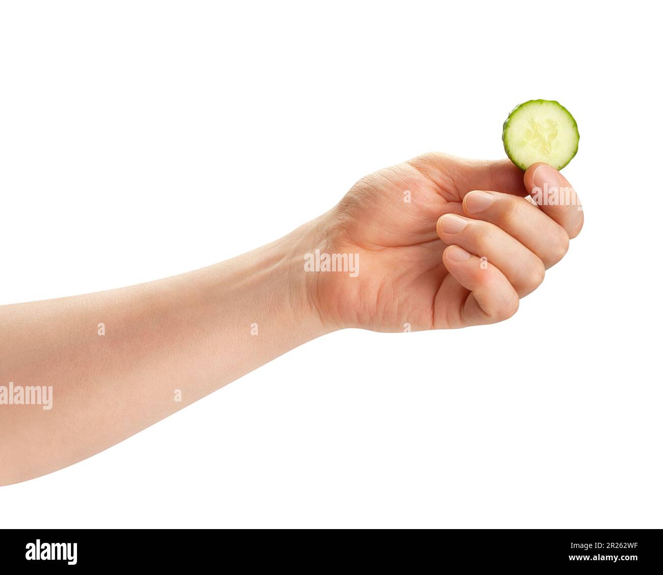 Hand holding cucumber Cut Out Stock Images & Pictures - Alamy