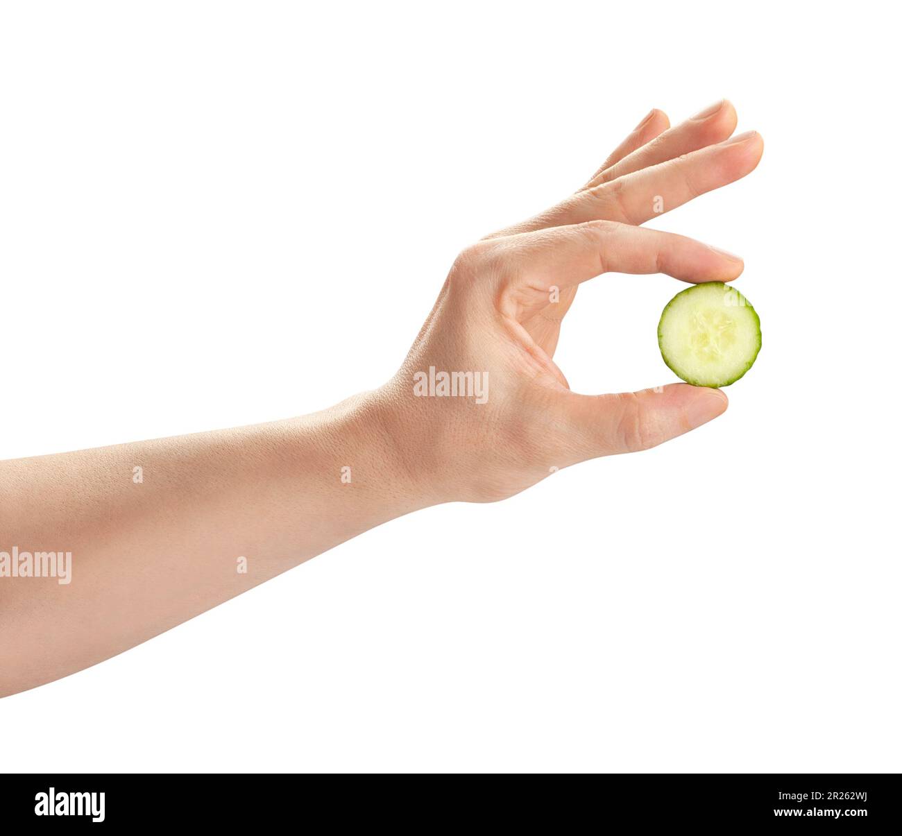 sliced cucumber in hand path isolated on white Stock Photo - Alamy