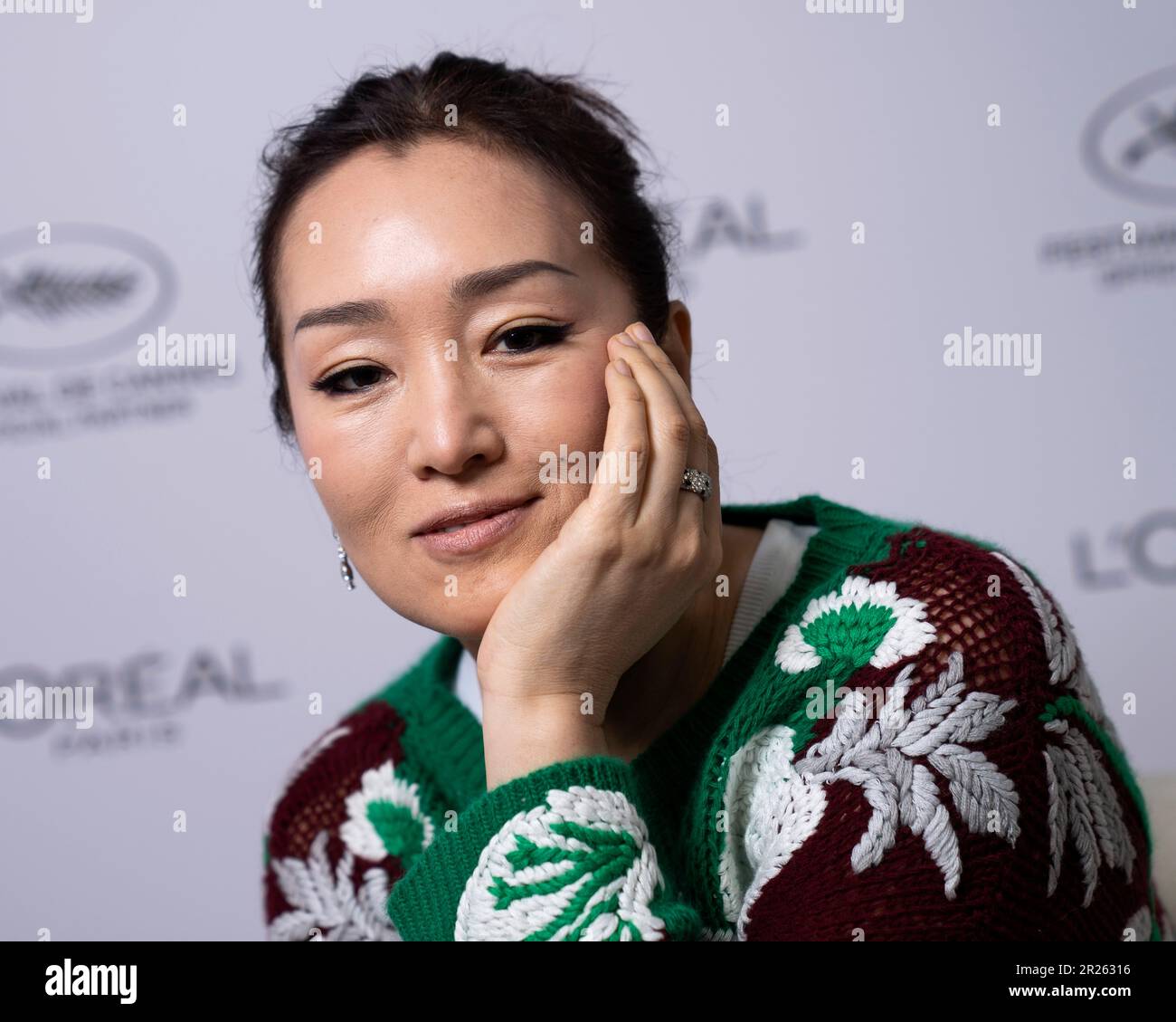 Gong Li poses for portrait photographs for at the 76th international ...