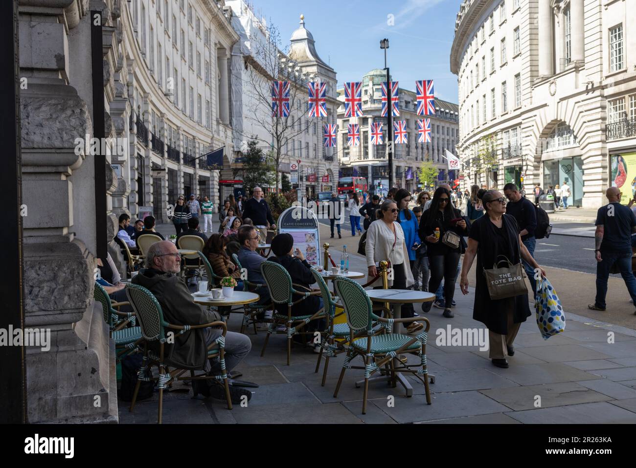 Tourists sitting outside Concerto cafe on Lower regent Street, enjoying ...